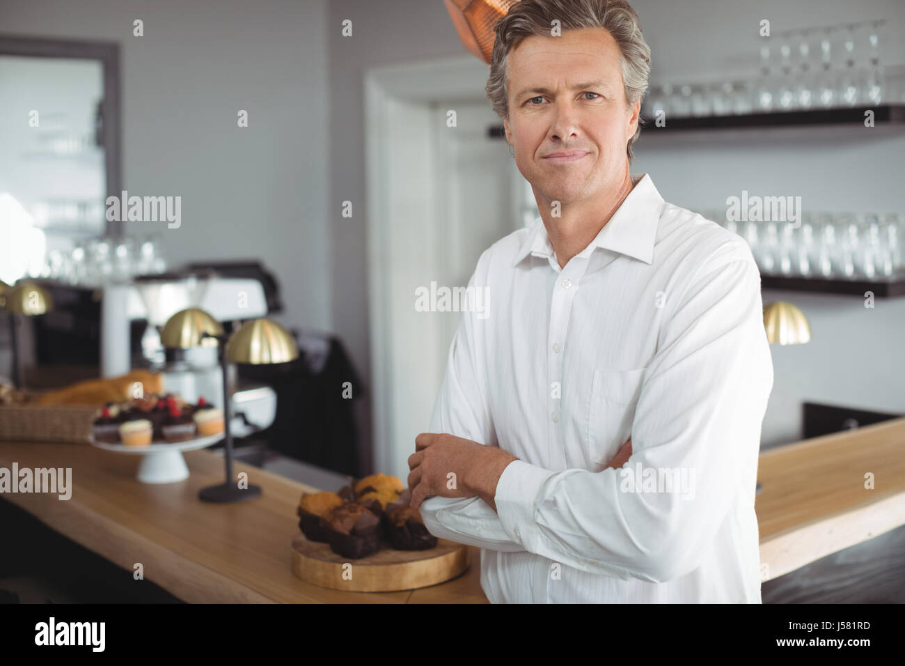 Portrait of waiters smiling at camera in a restaurant Stock Photo - Alamy