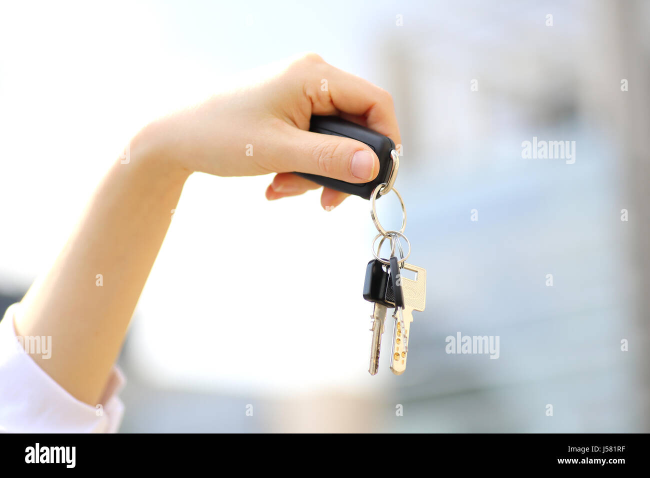 Woman Hand Holding Key Stock Photo - Alamy