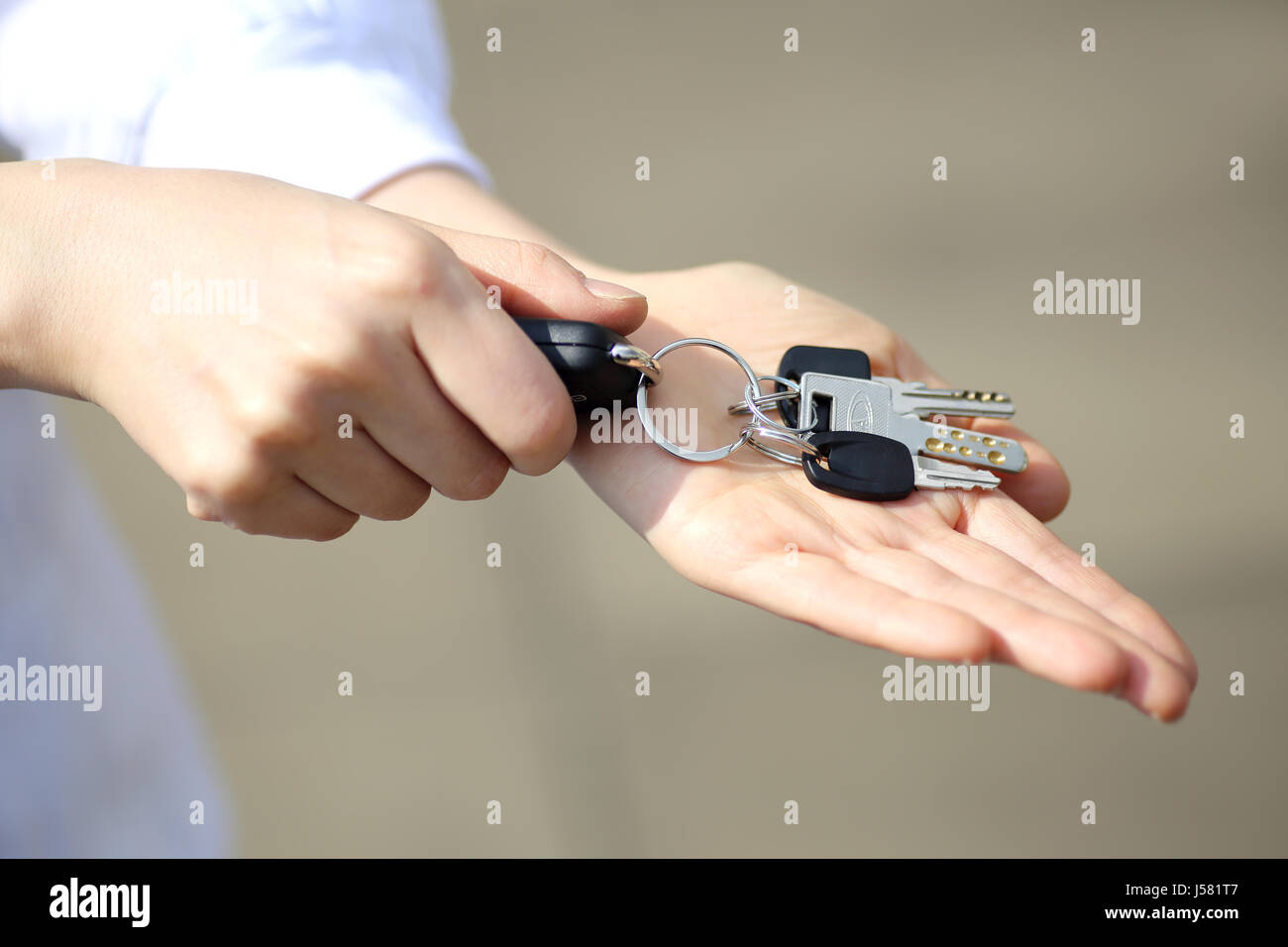 Woman Hand Holding Key Stock Photo - Alamy