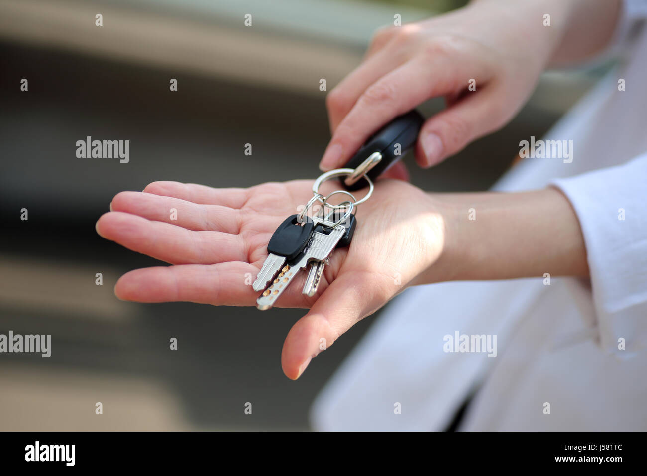 Woman Hand Holding Key Stock Photo - Alamy