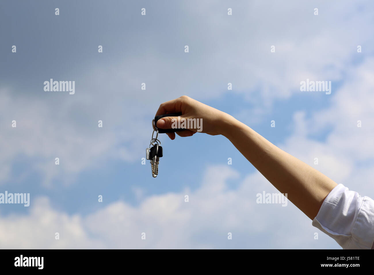 Woman Hand Holding Key Stock Photo - Alamy