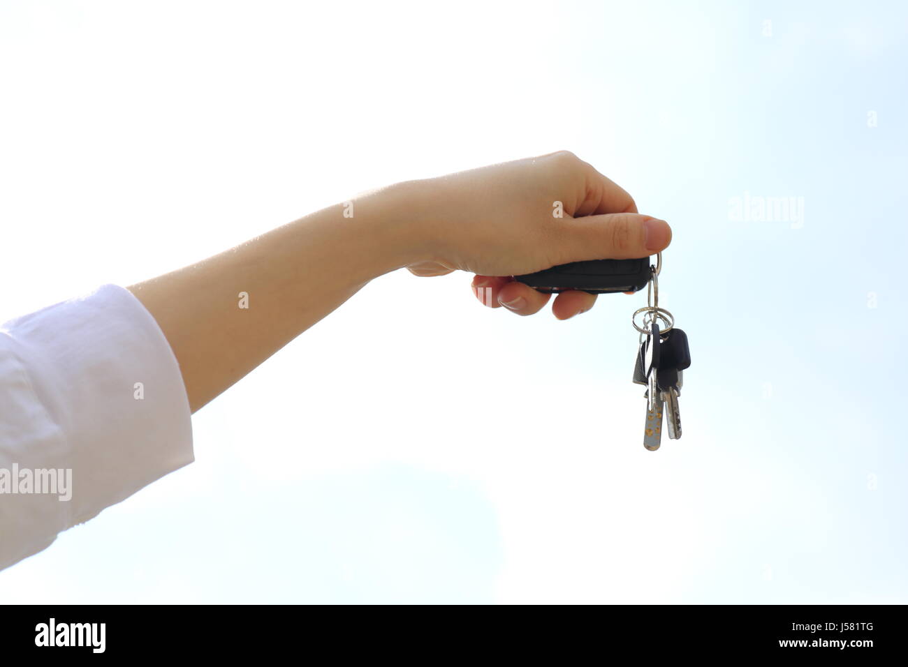 Woman Hand Holding Key Stock Photo - Alamy