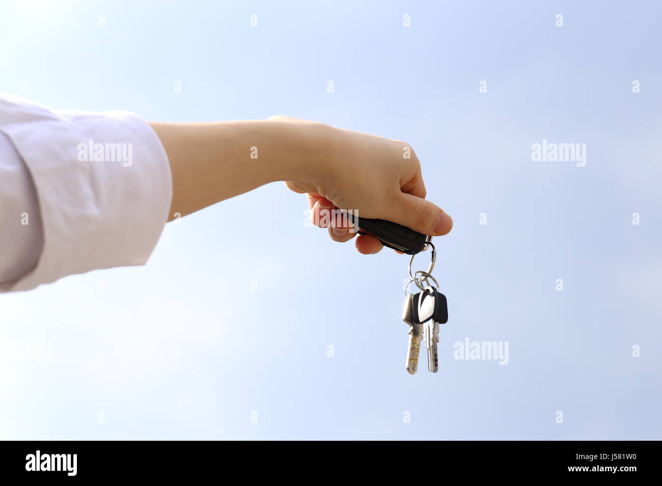 Woman Hand Holding Key Stock Photo - Alamy