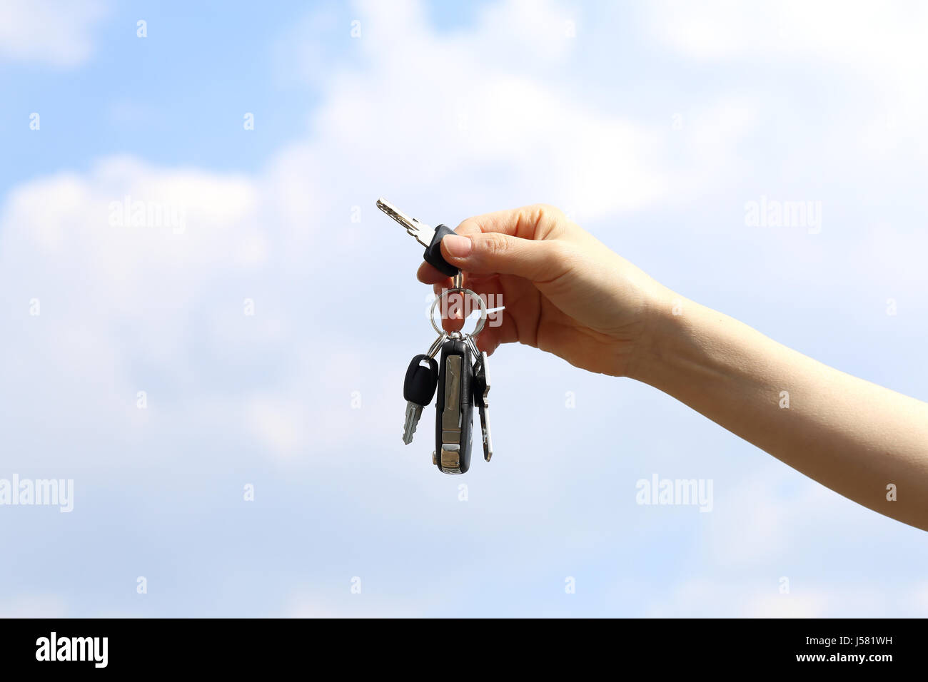 Woman Hand Holding Key Stock Photo - Alamy