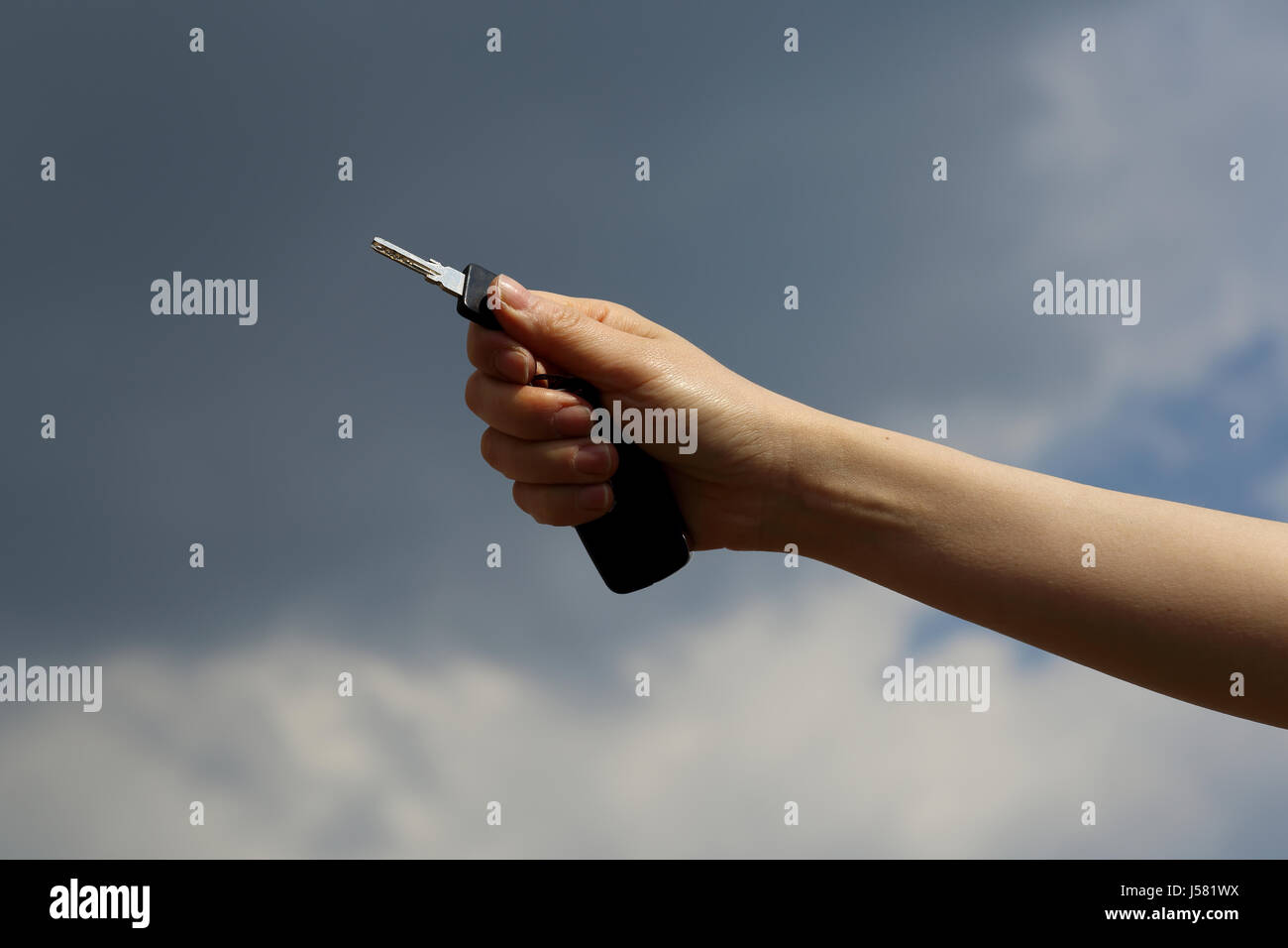 Woman Hand Holding Key Stock Photo - Alamy