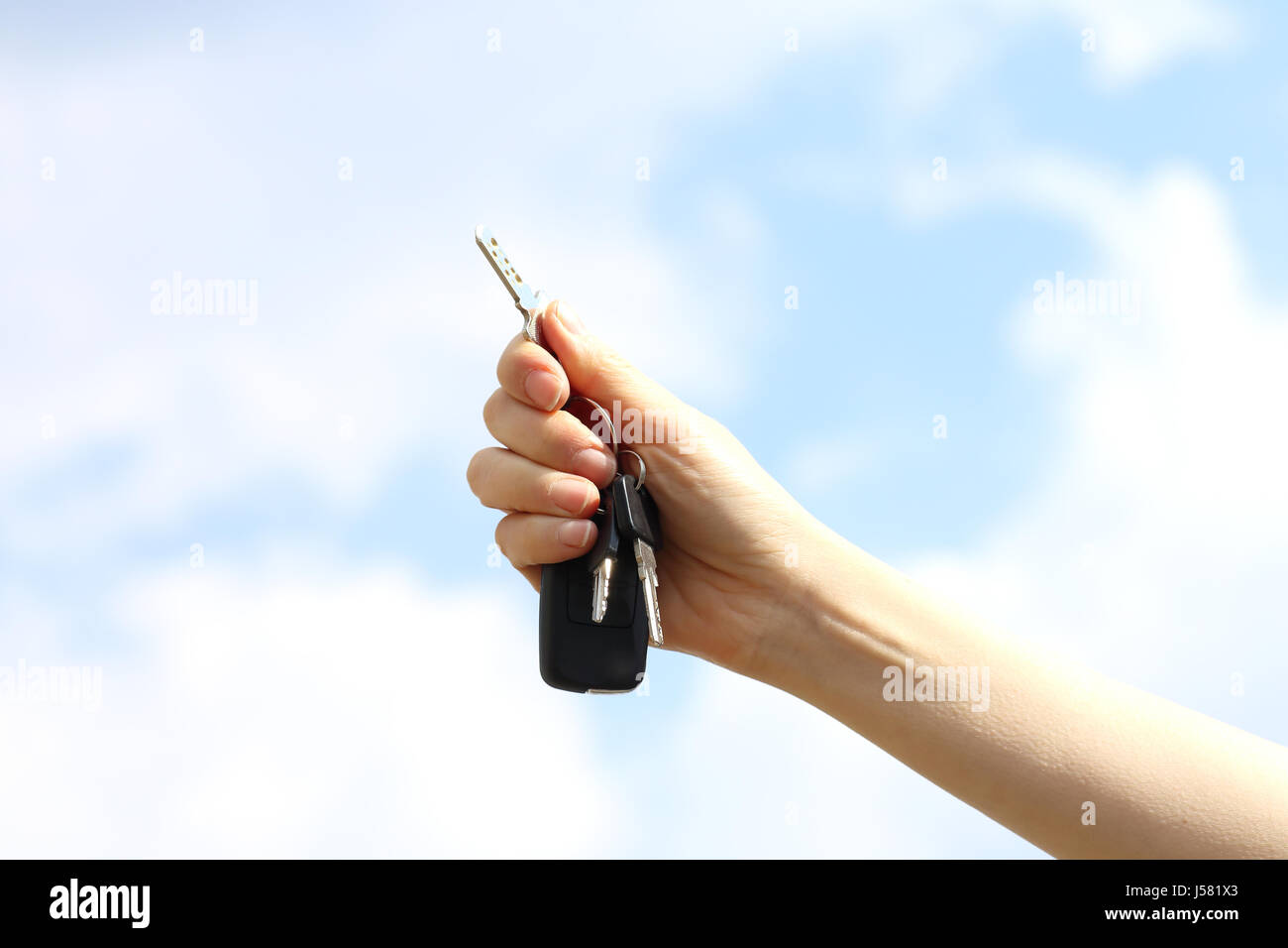 Woman Hand Holding Key Stock Photo - Alamy