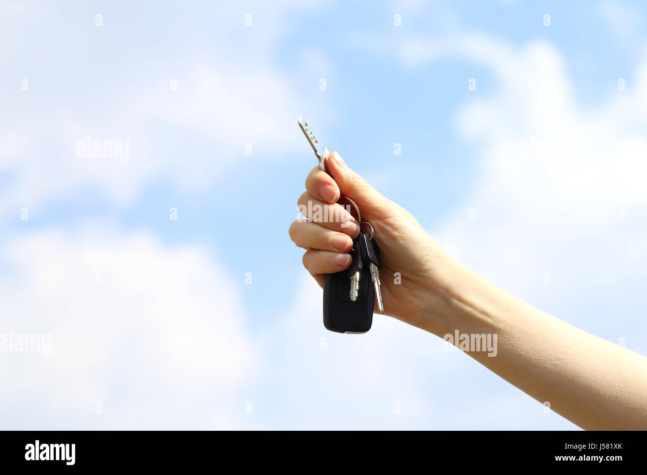 Woman Hand Holding Key Stock Photo - Alamy