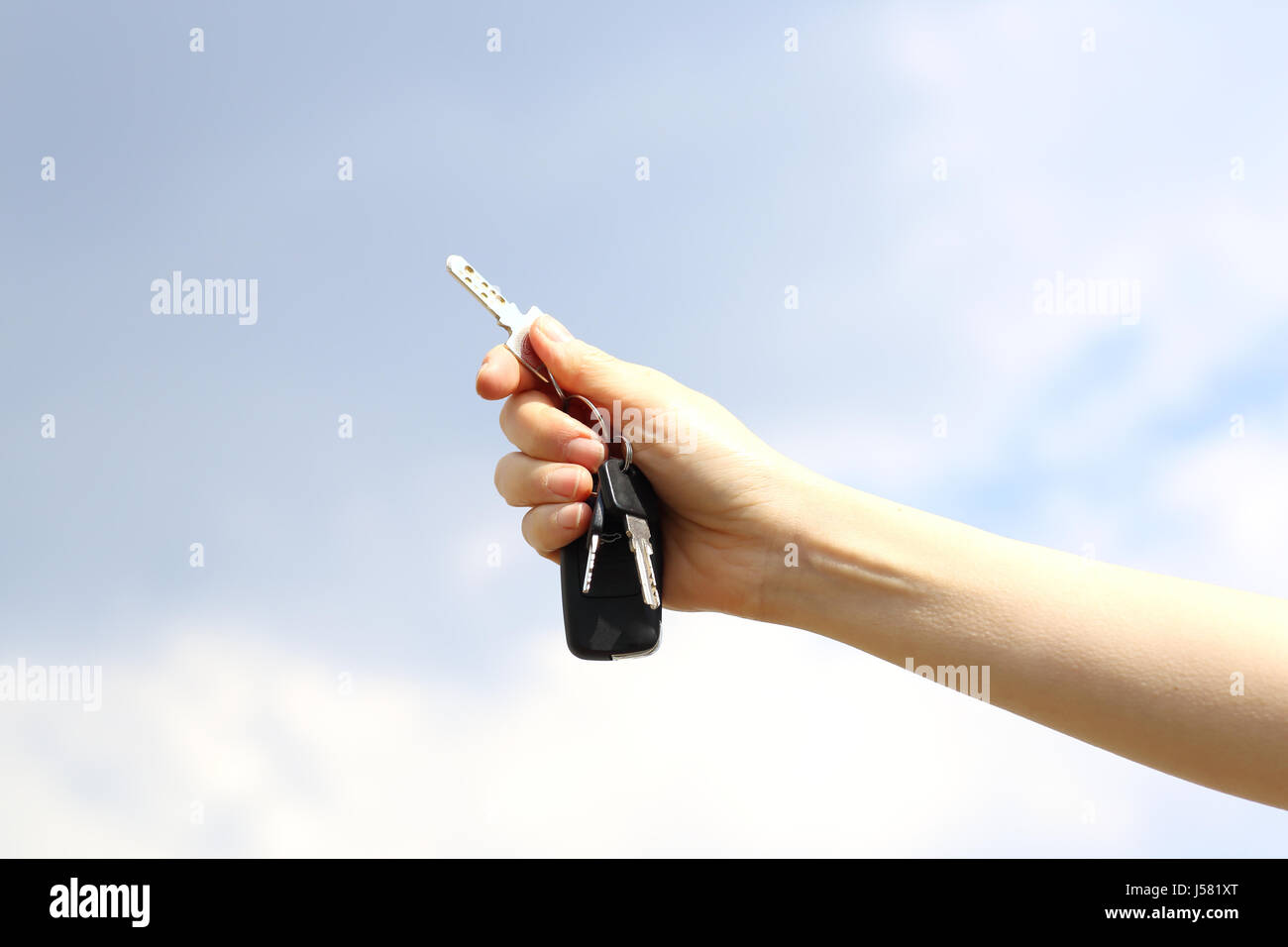 Woman Hand Holding Key Stock Photo - Alamy