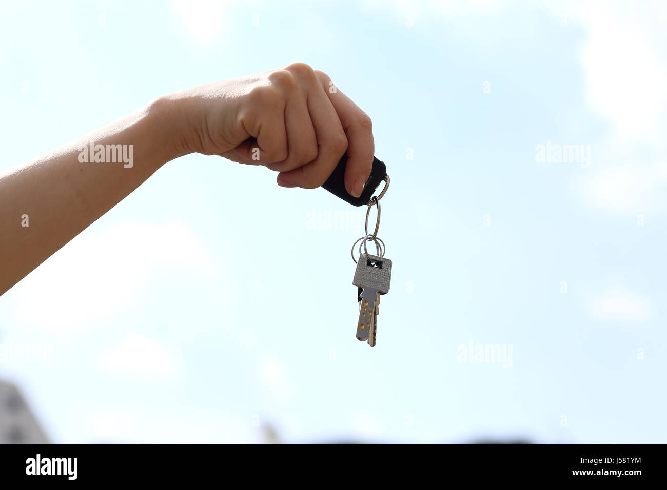 Woman Hand Holding Key Stock Photo - Alamy