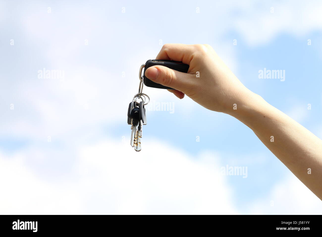 Woman Hand Holding Key Stock Photo - Alamy