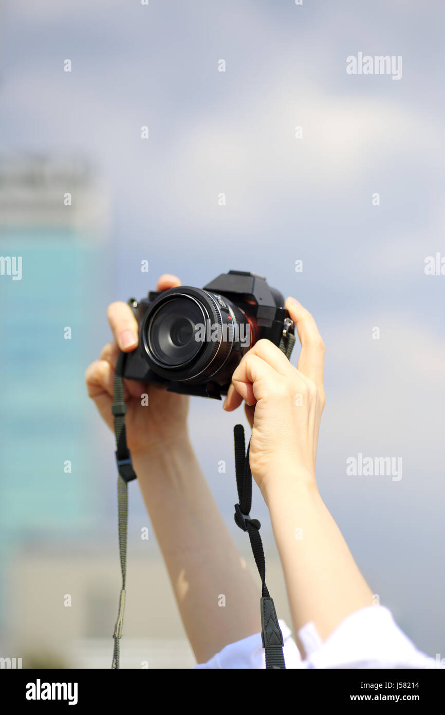 Woman Hand Holding Camera Stock Photo - Alamy