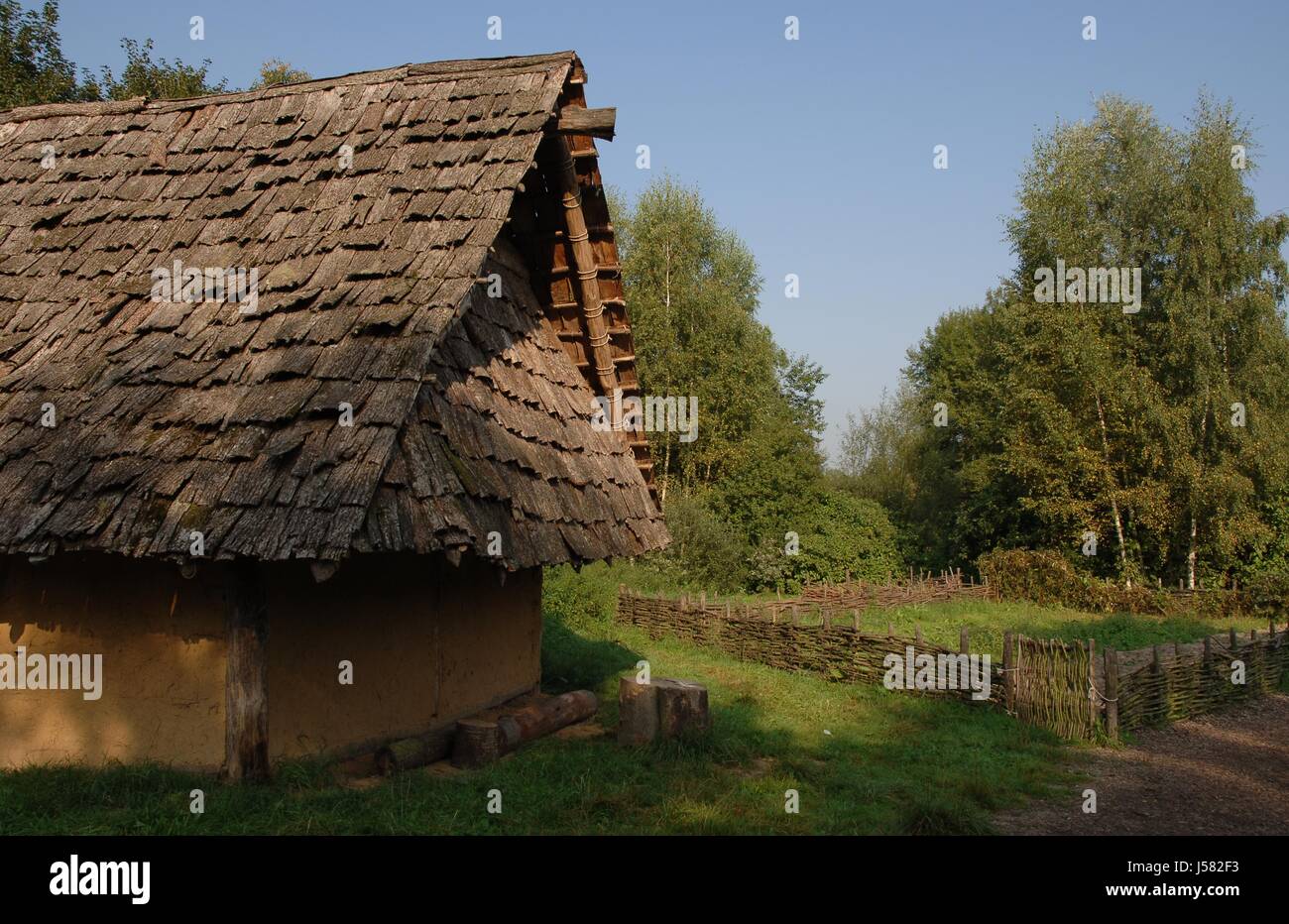 mud hut with bark roof Stock Photo - Alamy