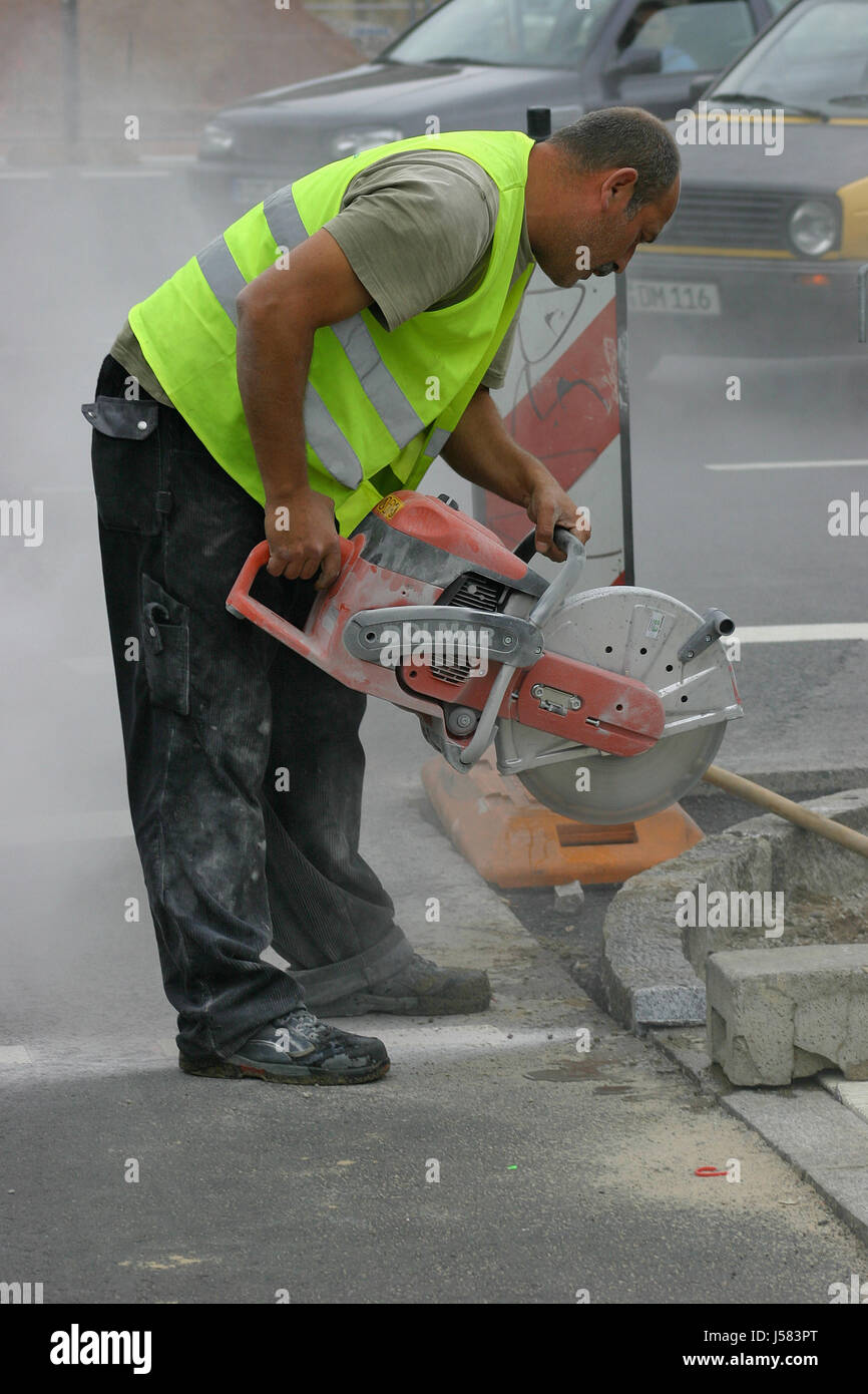 dust cloud working clothes curb edge separate saw blade workers laborer ...