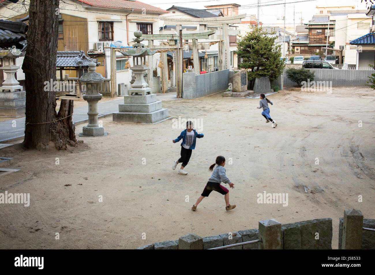 Children playing at Shrine Stock Photo - Alamy