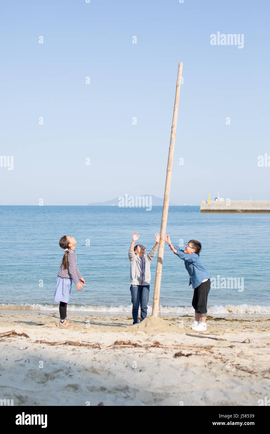 Children playing at Seashore Stock Photo - Alamy