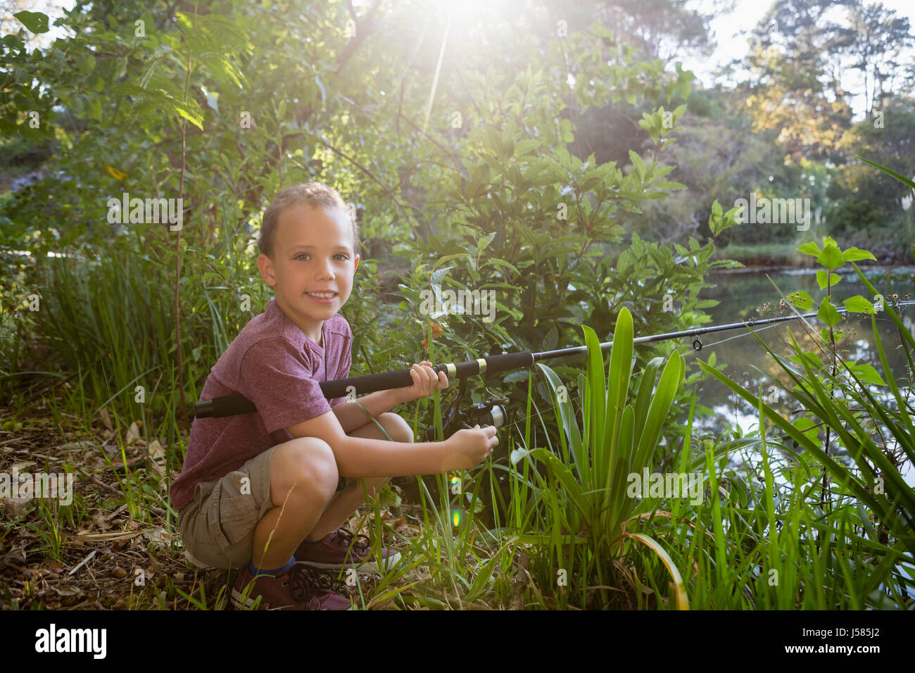 Portrait of boy fishing hi-res stock photography and images - Alamy