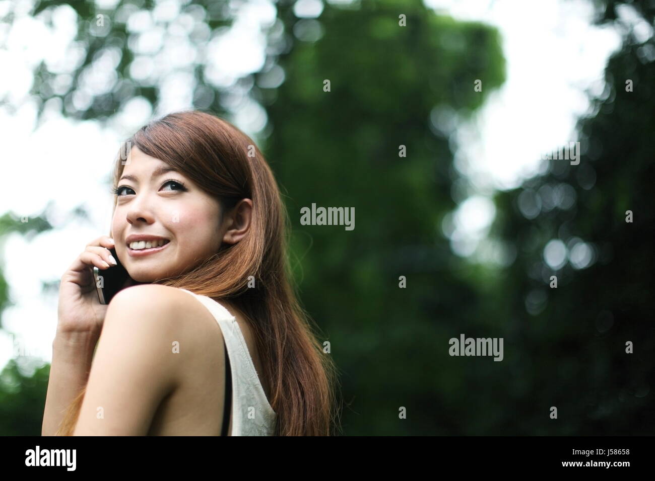 Young woman calling Stock Photo - Alamy