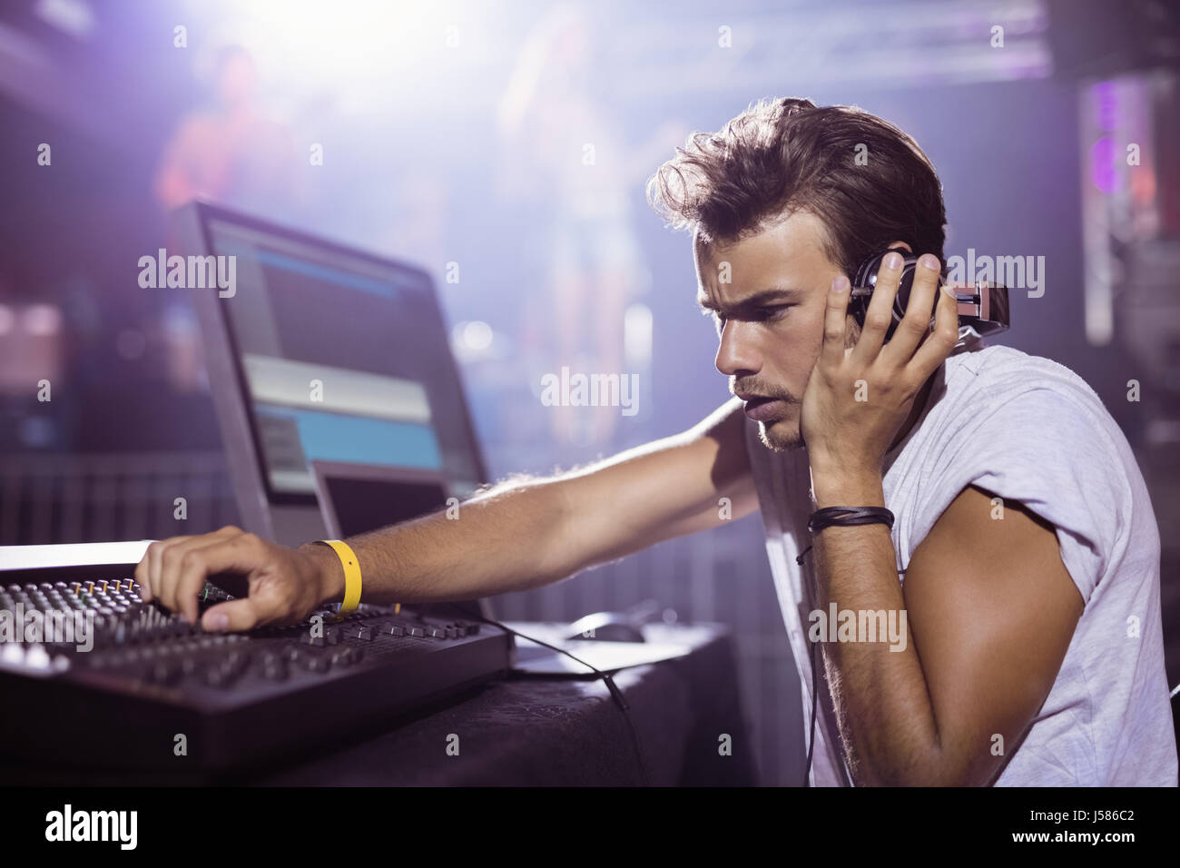 Young male dj performing at nightclub during music festival Stock Photo ...