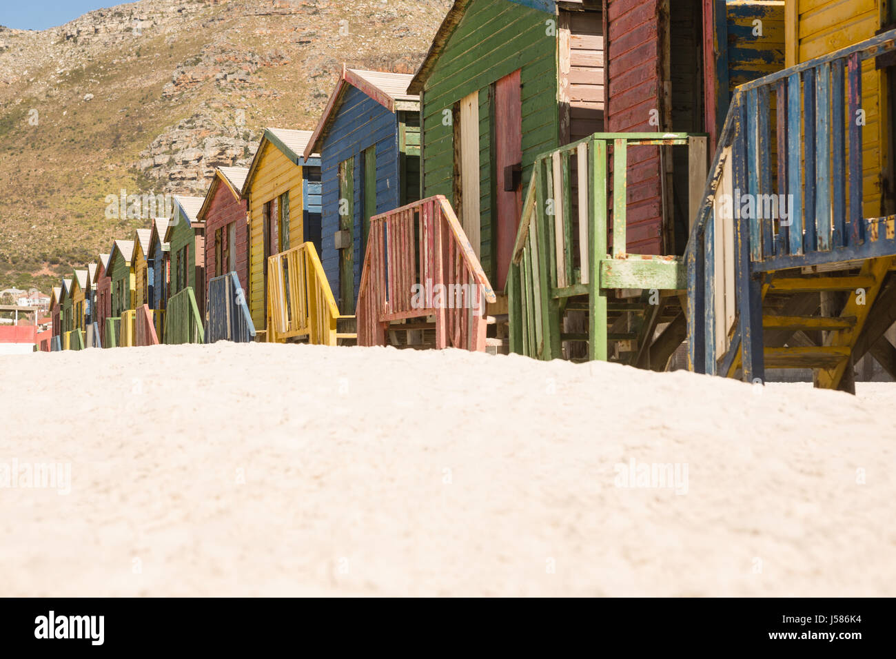 Close up of multi colored huts at beach during suny day Stock Photo - Alamy