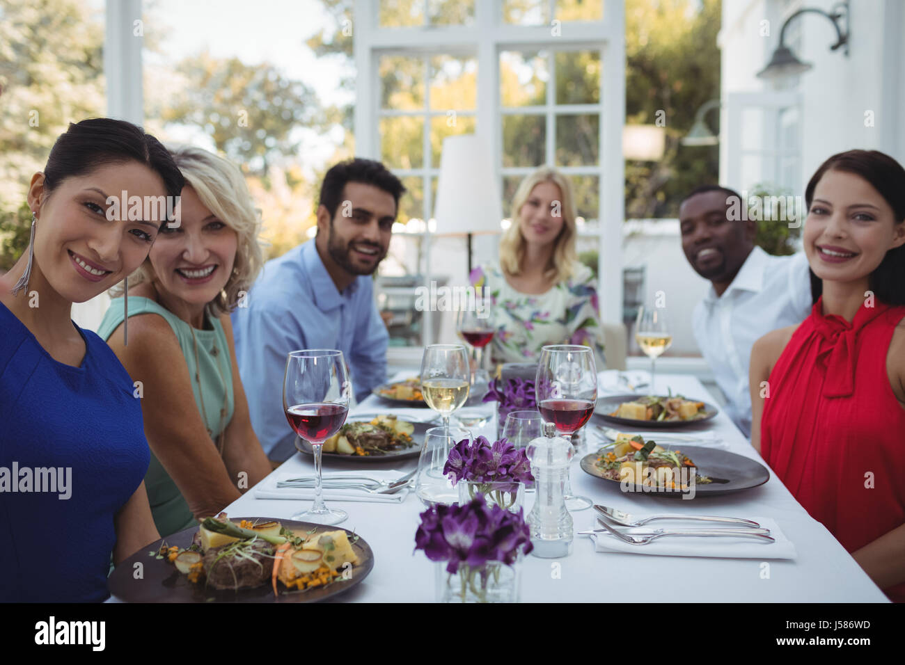 Portrait of happy friends having lunch together in restaurant Stock ...