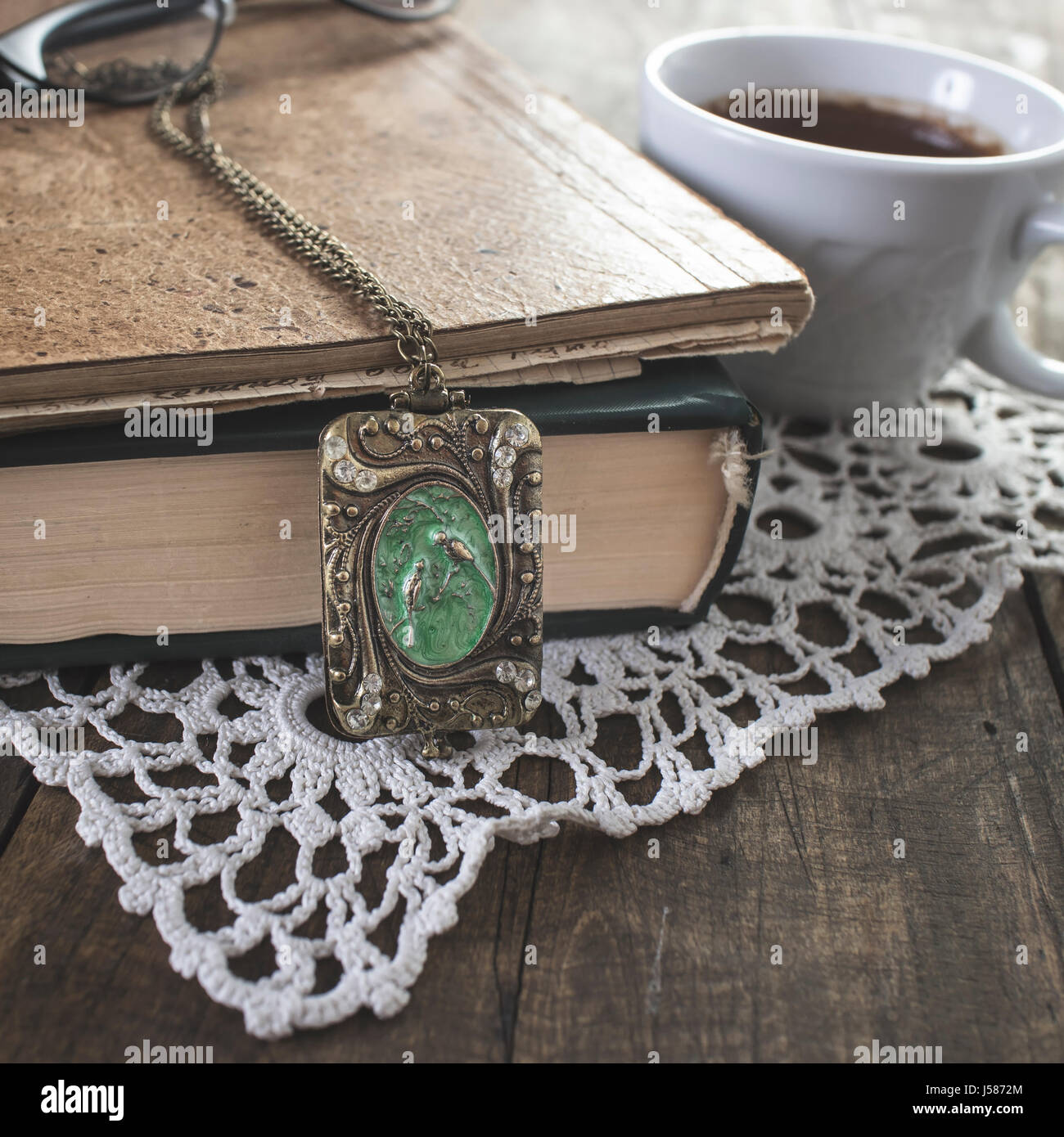 notebook with old necklace, close up Stock Photo - Alamy