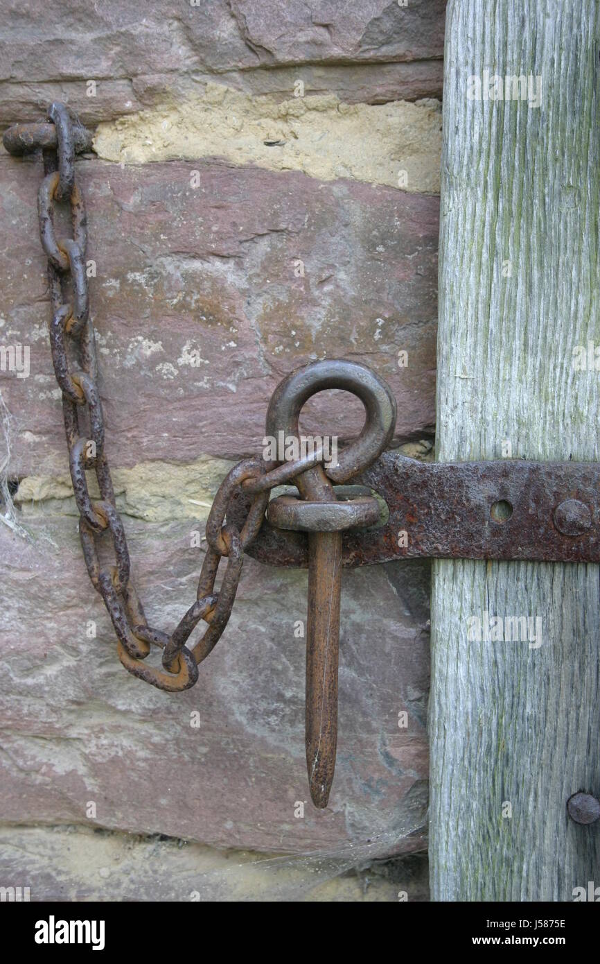 door chain wall rusty rust rusted hook stonewall bolt spider webs metal ...