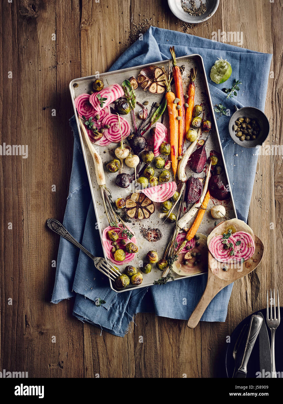 Brussel sprouts and root vegetables with capers from the oven Stock ...