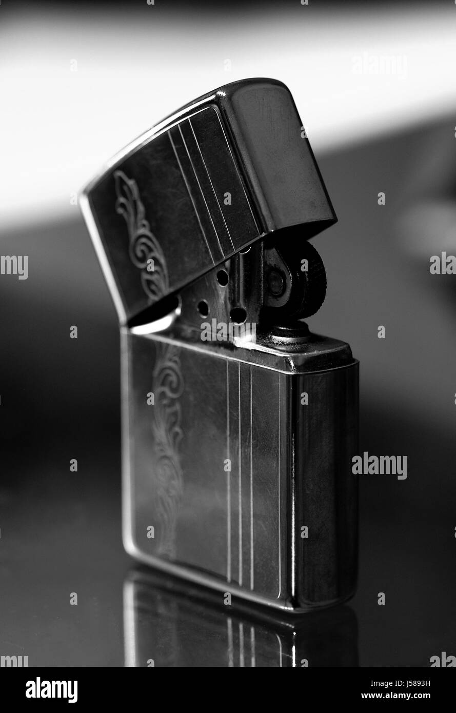 Silver lighter Black and White Stock Photos & Images - Alamy
