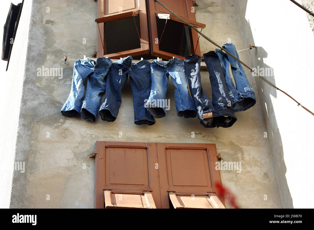 blue window porthole dormer window pane jeans trousers jean trousers ...