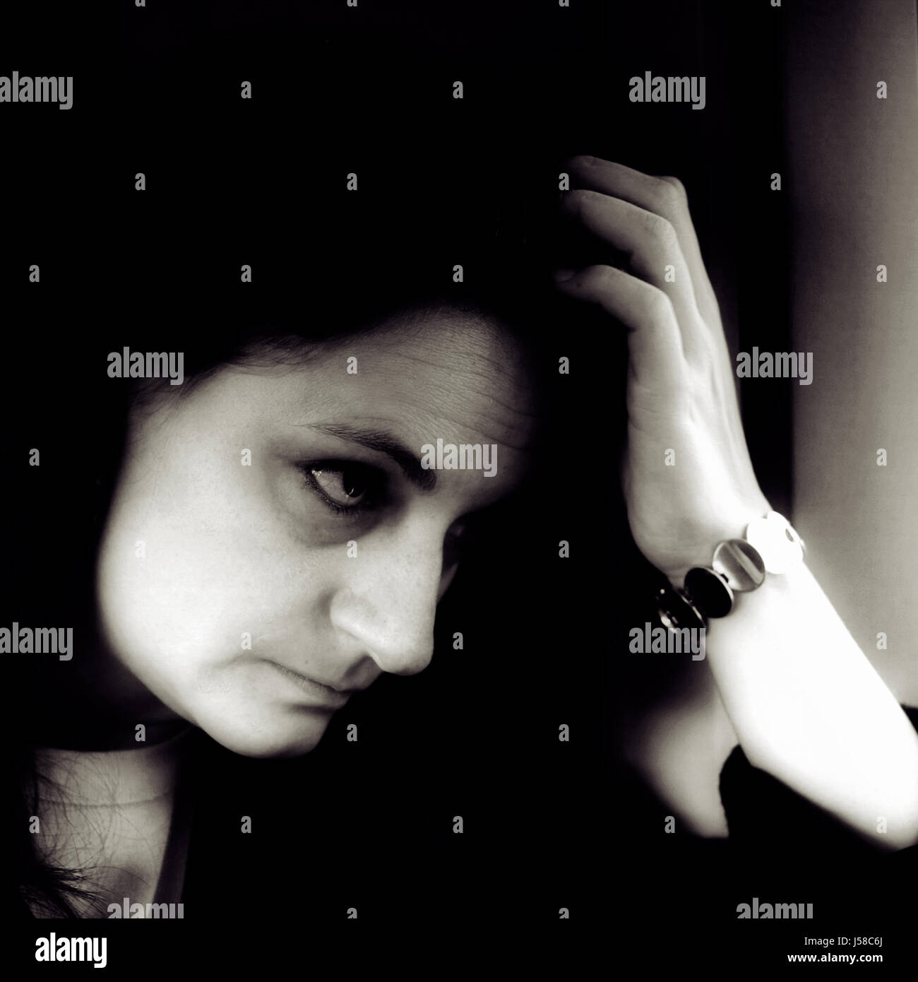 Woman hand over mouth thoughtful hi-res stock photography and images ...