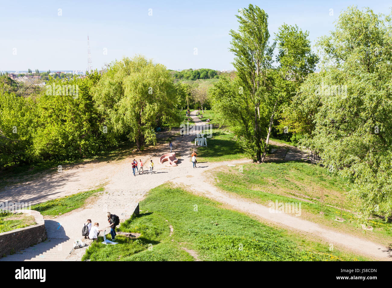 KIEV, UKRAINE - MAY 5, 2017: tourists in urban park on Gonchary ...