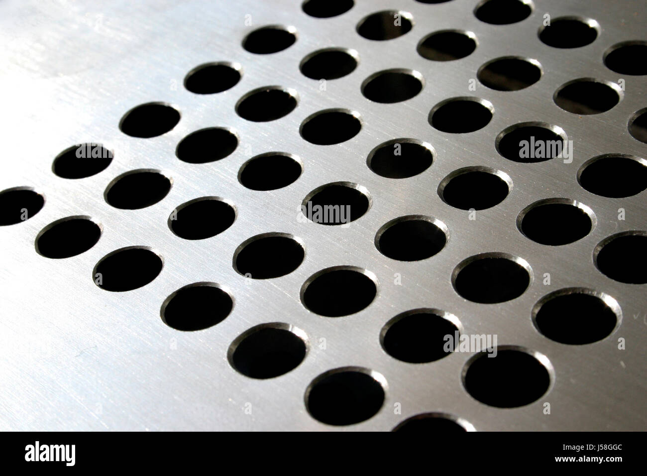 metal and holes Stock Photo - Alamy