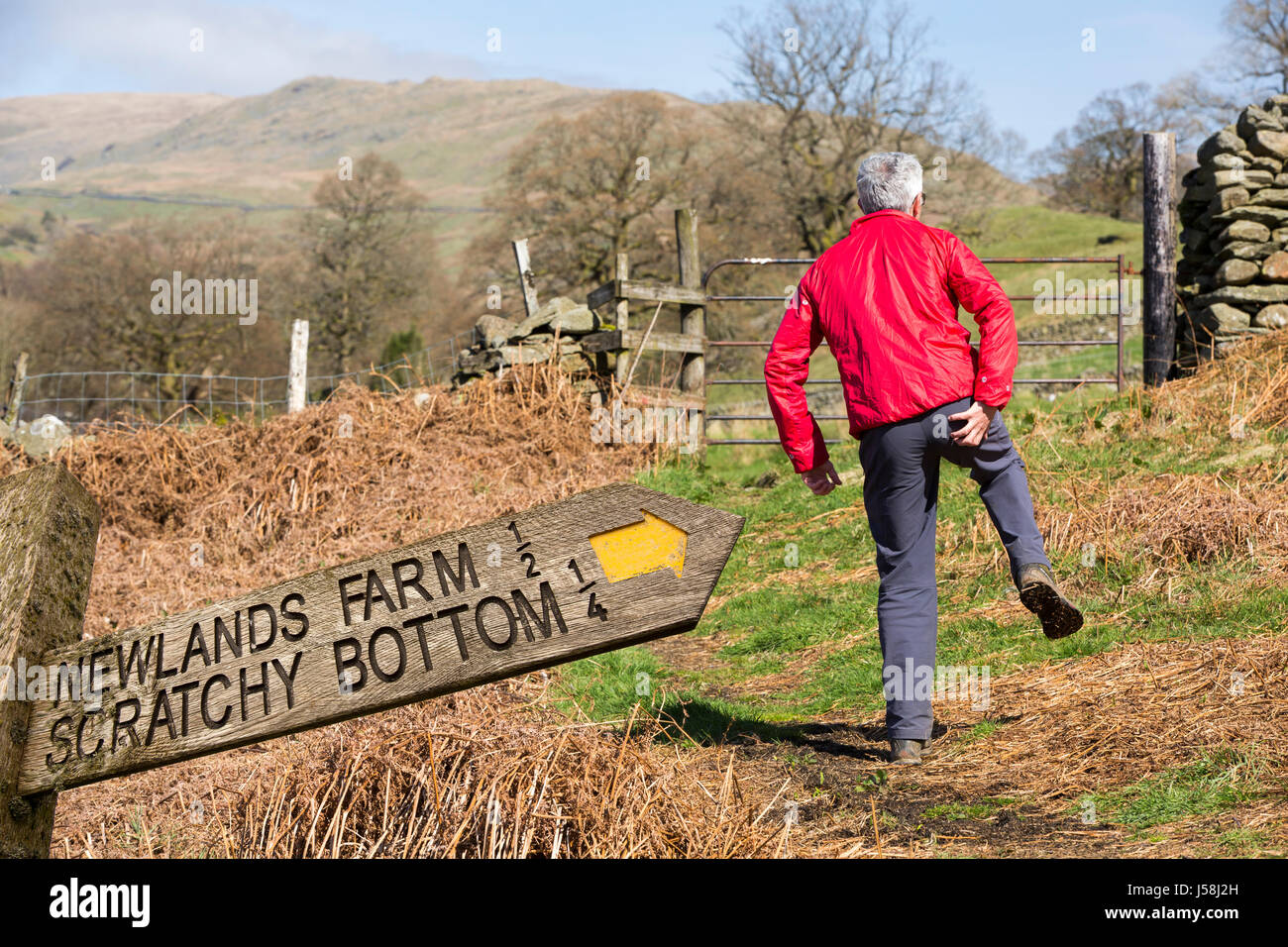 A man scratching his backside with a sign to scratchy bottom Stock ...