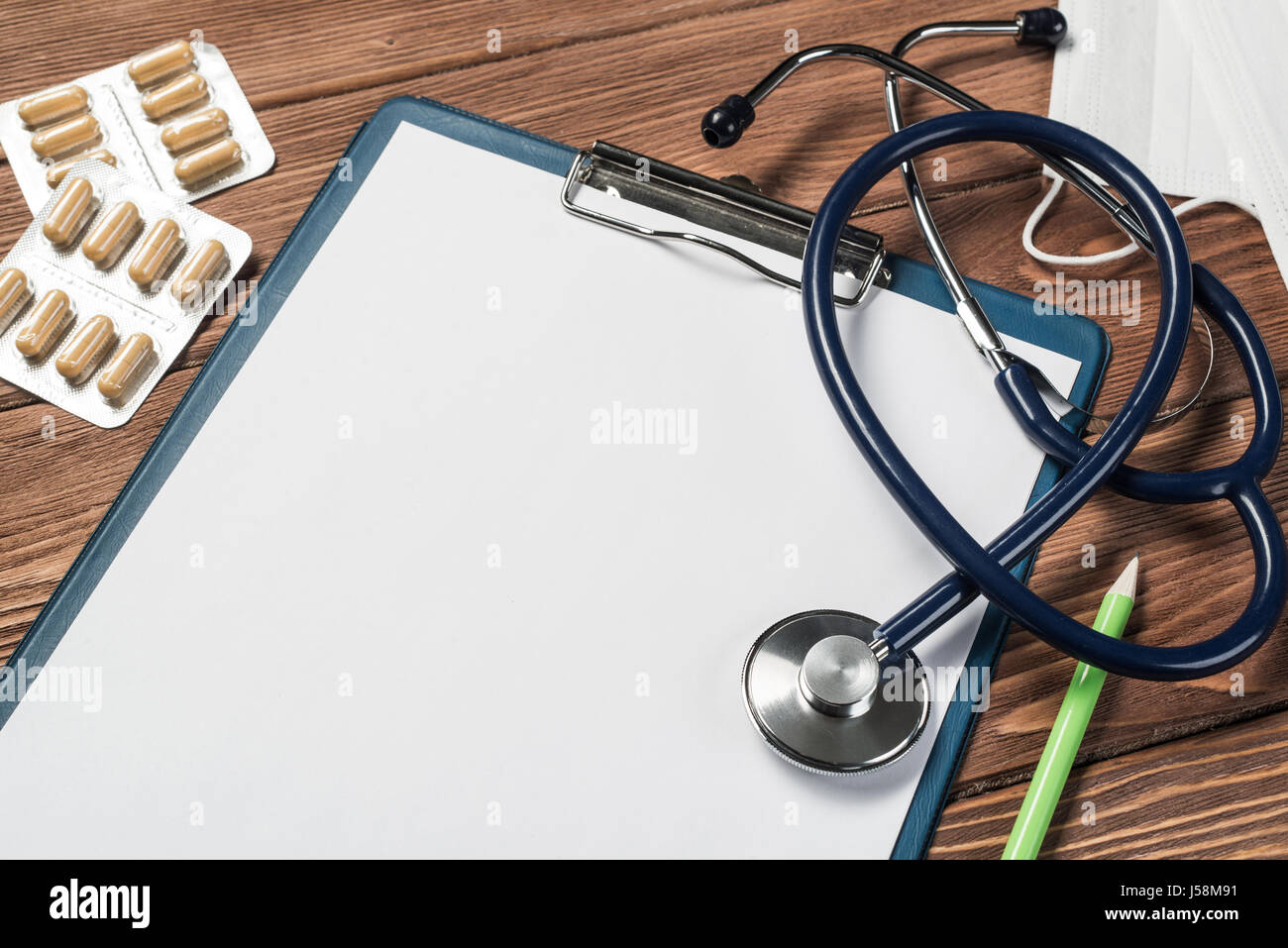 Desk of doctor with medicine things Stock Photo - Alamy