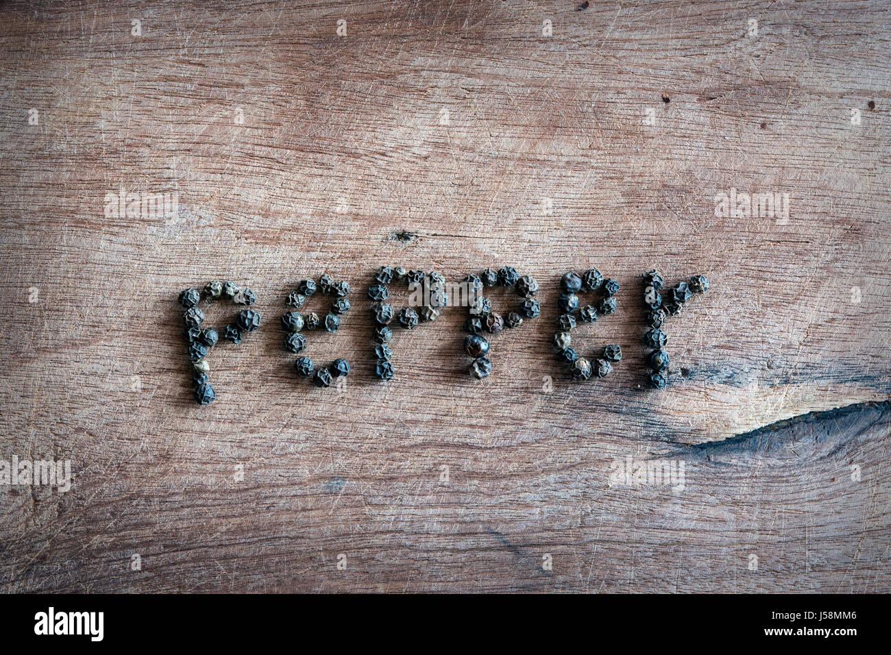 Word "pepper" made of peppercorns on wooden background Stock Photo - Alamy