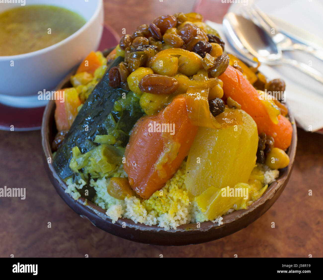 Chicken couscous, a typical North African dish. The bowl left ...
