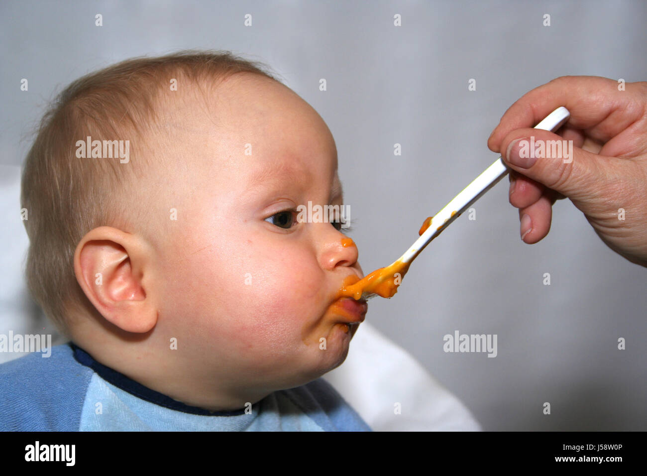 hand male masculine portrait baby feed ingestion pap infant food eating ...