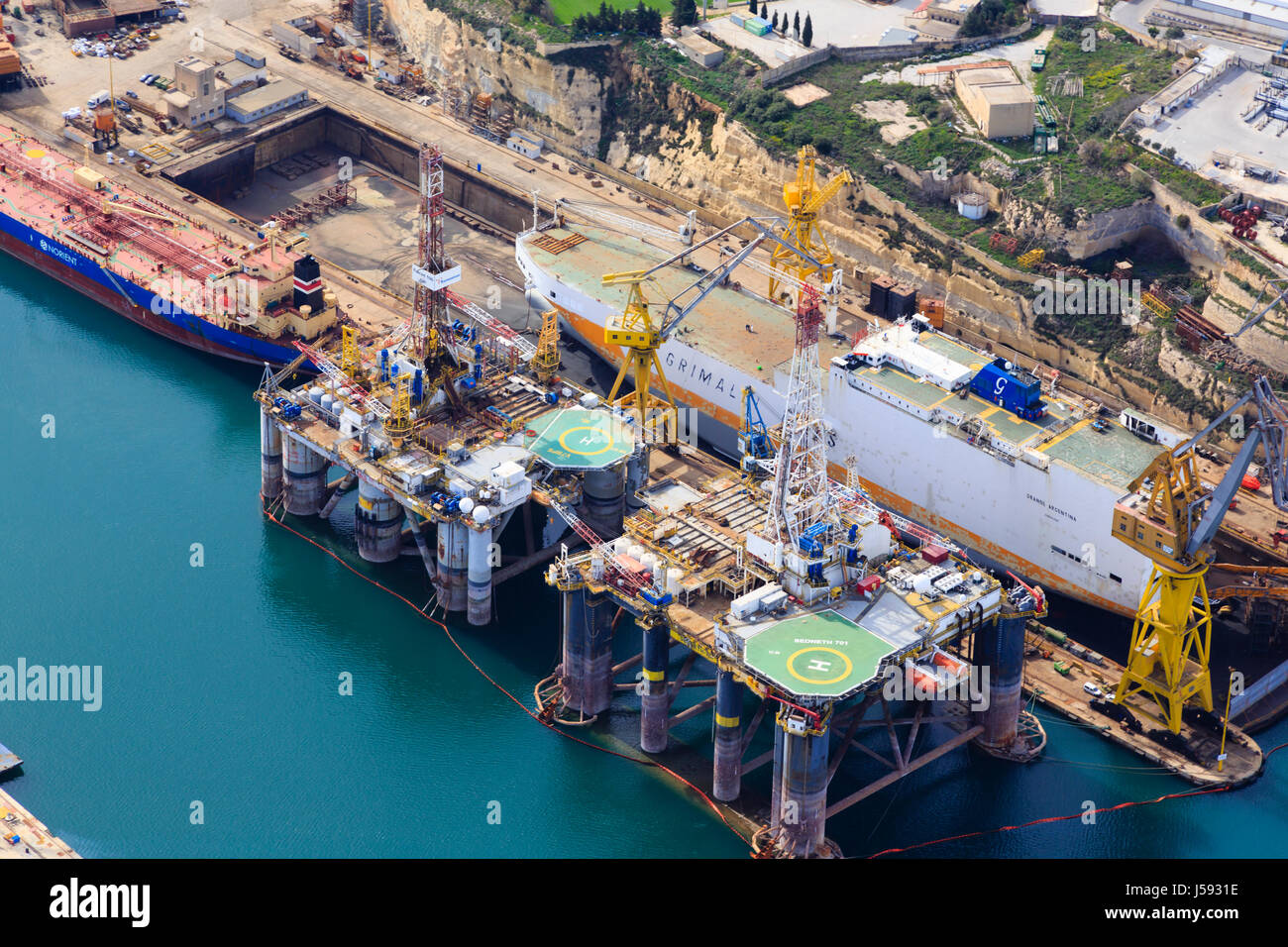 Dry dock and oil platform repair in Valletta Grand Harbour, Malta Stock ...