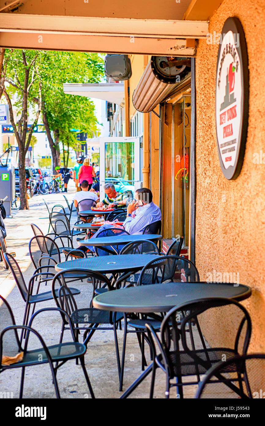 People sitting outside on the sidewalk at cafes in downtown Tampa, FL ...