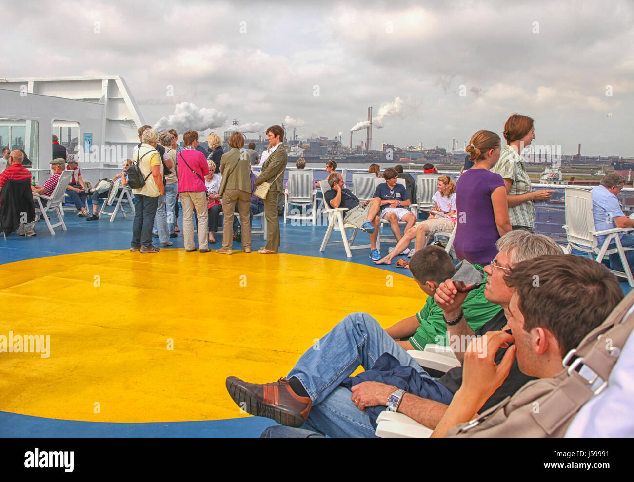 IJMUIDEN, THE NETHERLANDS- JULY 10: People on the sundeck of DFDS ...