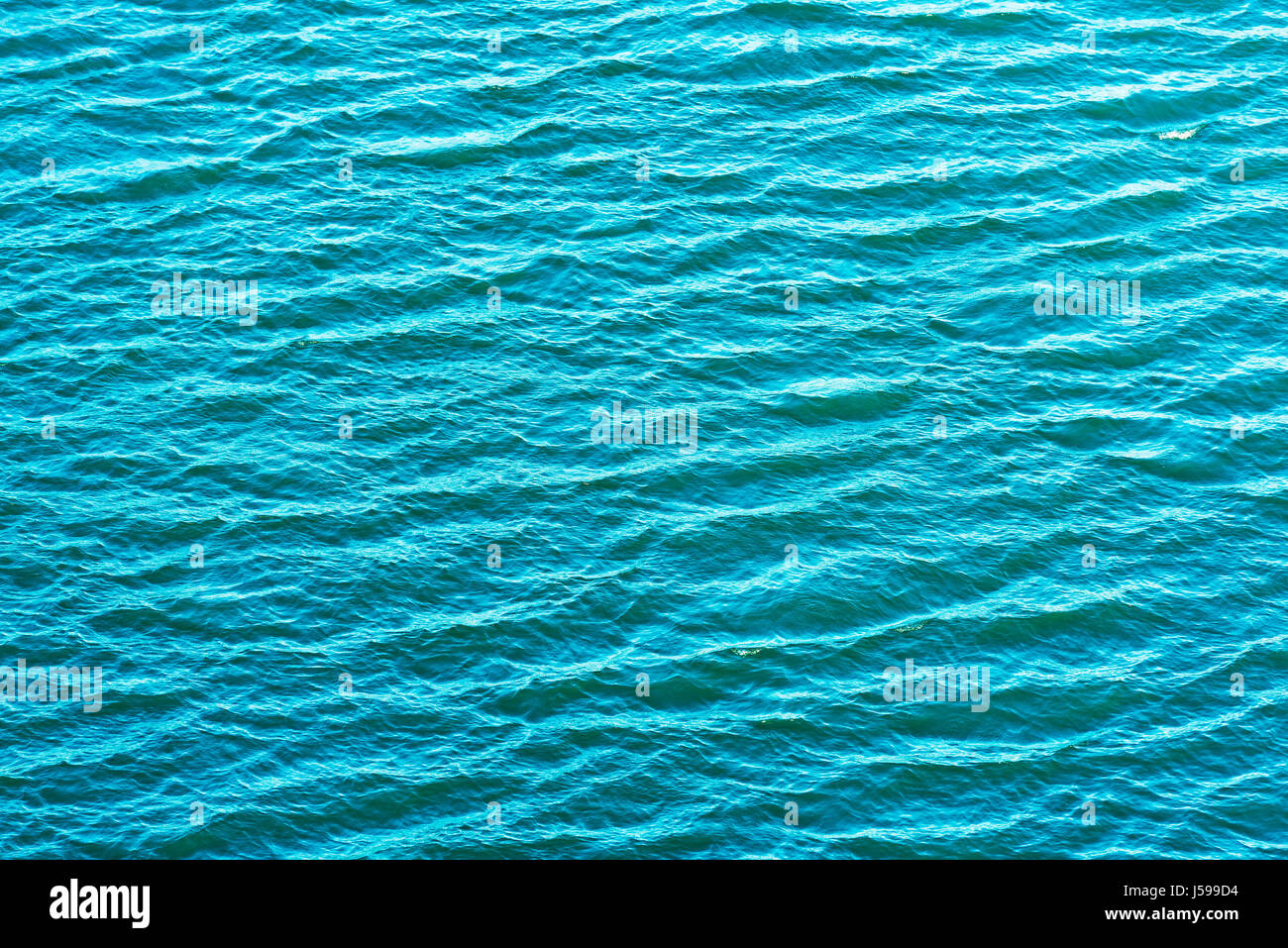 Ocean waves with gentle ripples form a background Stock Photo - Alamy