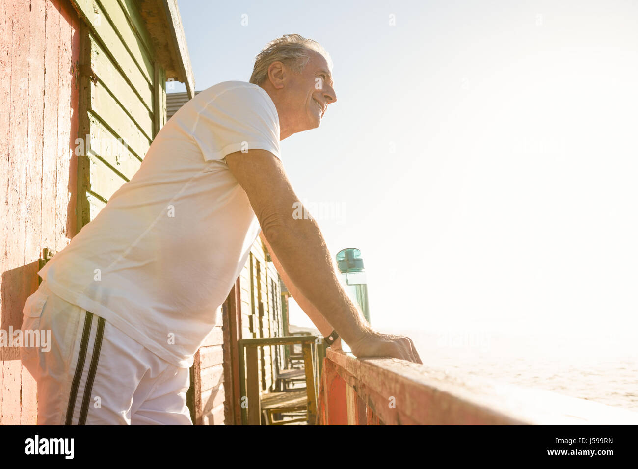 Man on railing hi-res stock photography and images - Alamy