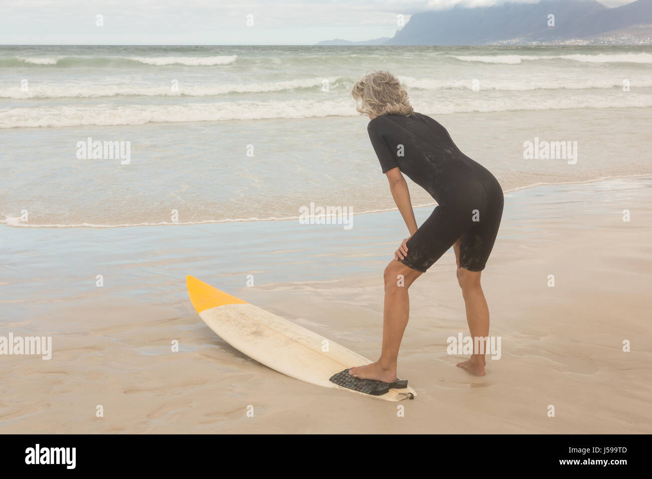 Bending over rear view hi-res stock photography and images - Alamy