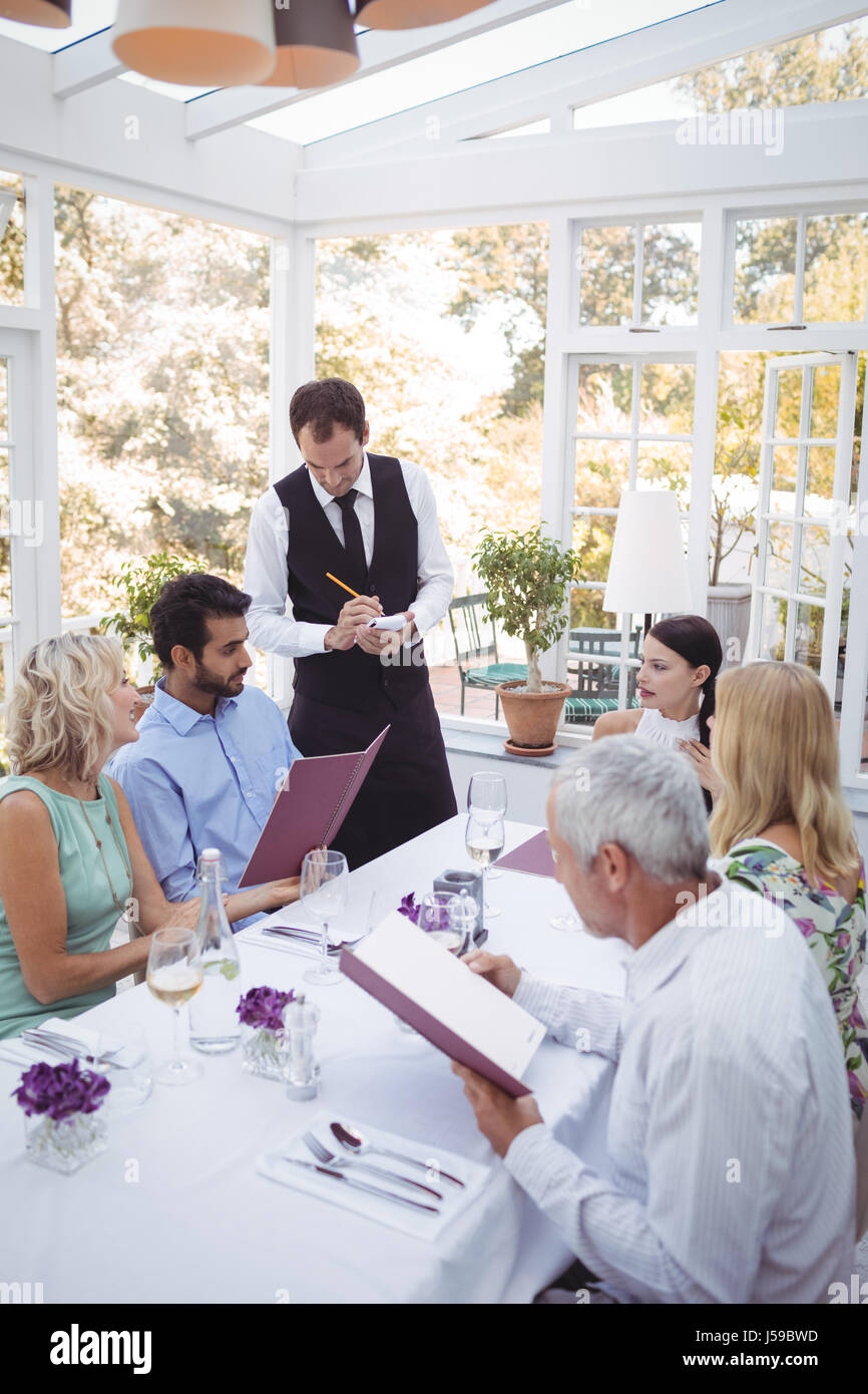 Woman in restaurant placing order hi-res stock photography and images ...