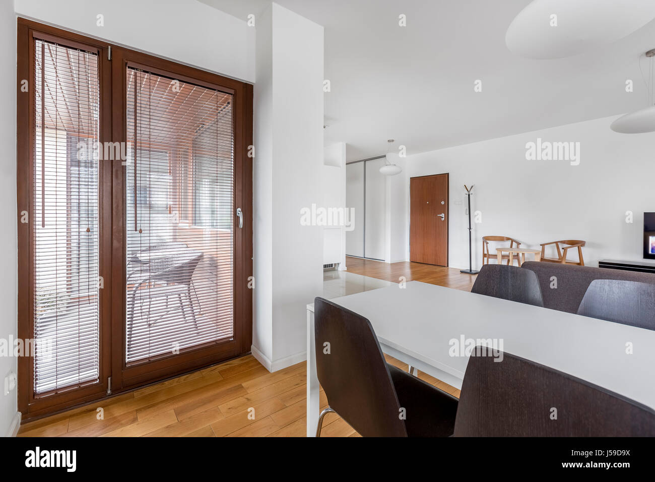 Modern open apartment with dining space and terrace Stock Photo - Alamy