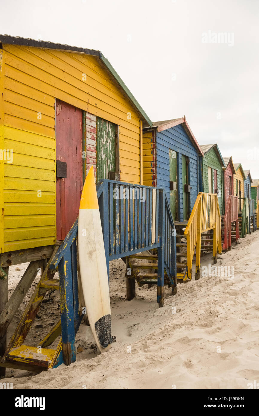 Surfboard by wooden hut at beach Stock Photo - Alamy