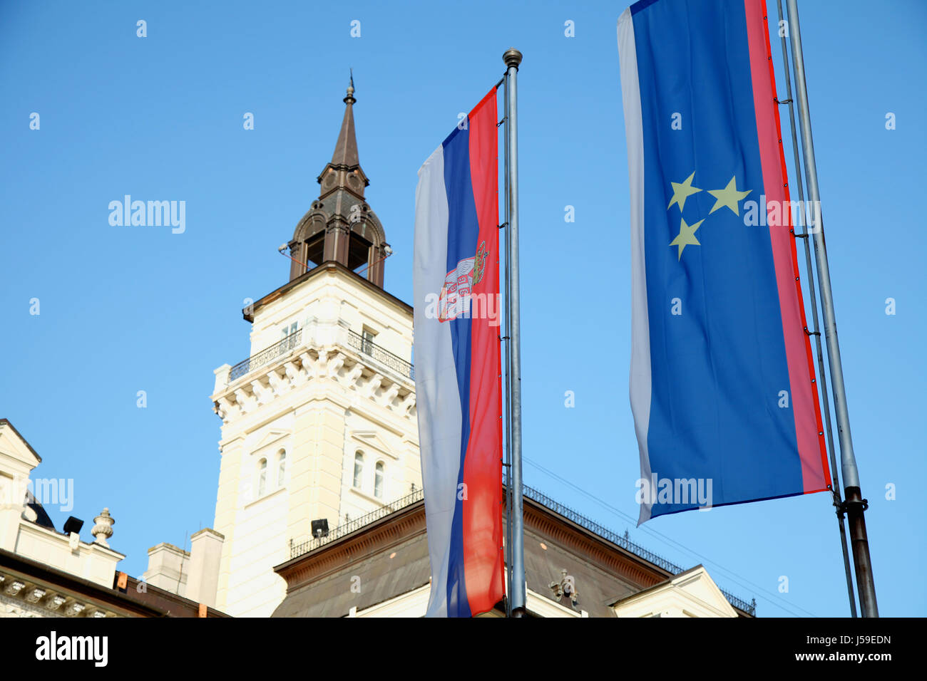 Serbian flag in Novi Sad and City Hall tower in Novi Sad, Serbia Stock ...
