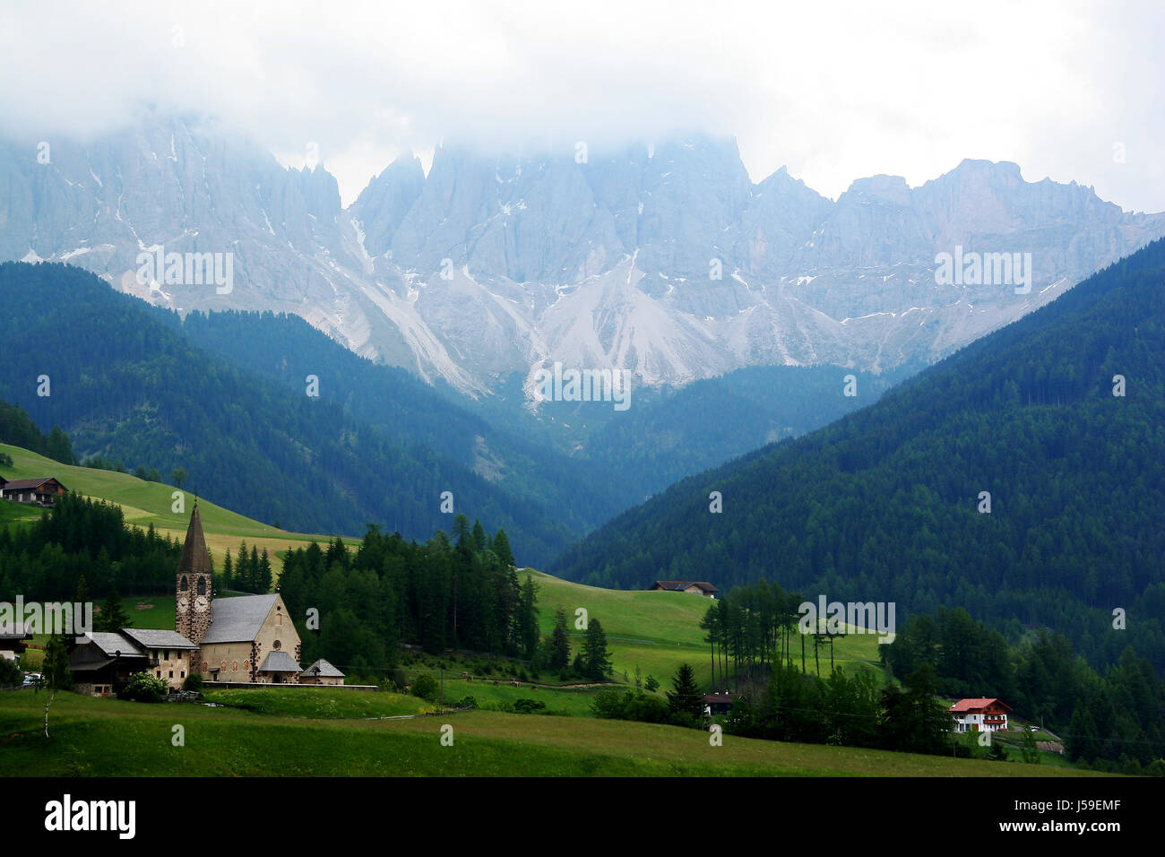 the geisler peaks in clouds Stock Photo - Alamy