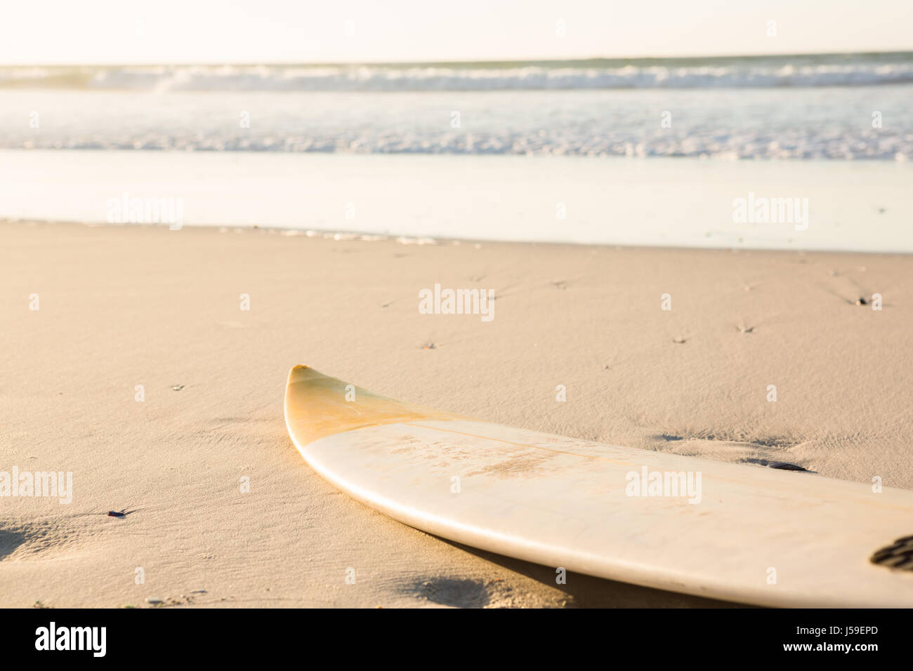 Surfboard on shore at beach Stock Photo - Alamy