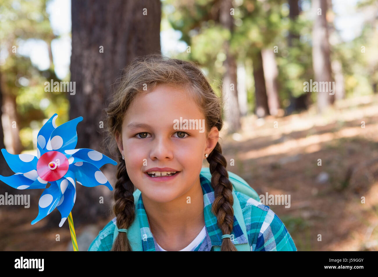 Girl with a pinwheel hi-res stock photography and images - Alamy